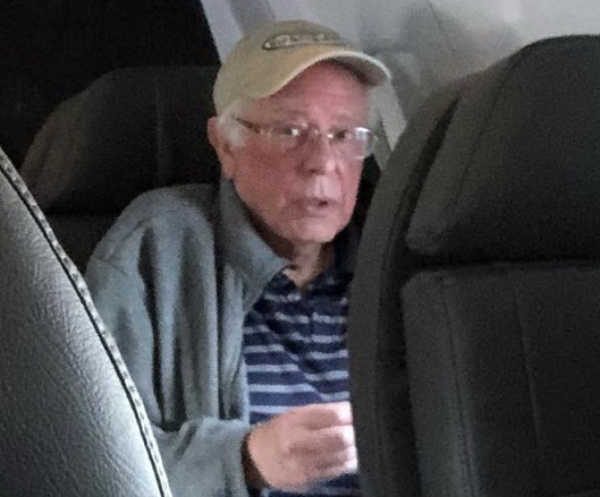 Socialist Bernie looks nervous after he's caught flying first class