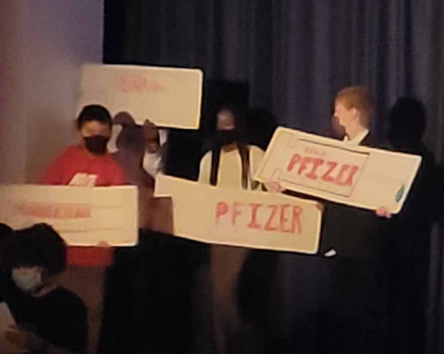 Middle School Children Made to Dance Around with Pfizer & Moderna Signs